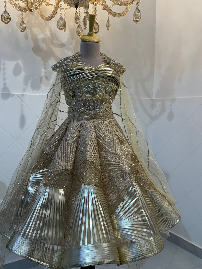 Dripping in gold metallic gown